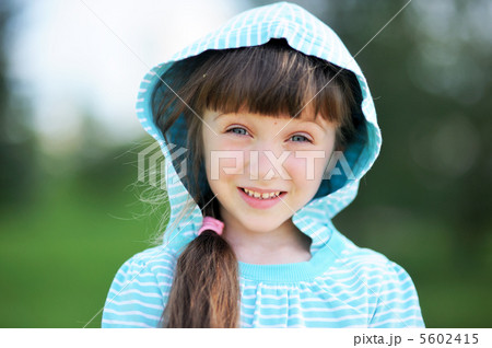 Outdoor portrait of cute child girl in blue jacketの写真素材 [5602415] - PIXTA