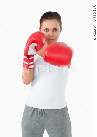 Young female boxer striking with her leftの写真素材 [6435150] - PIXTA