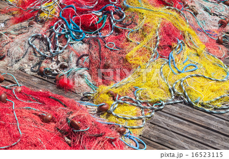 Colorful fishing nets lay on wooden pierの写真素材 [16523115] - PIXTA
