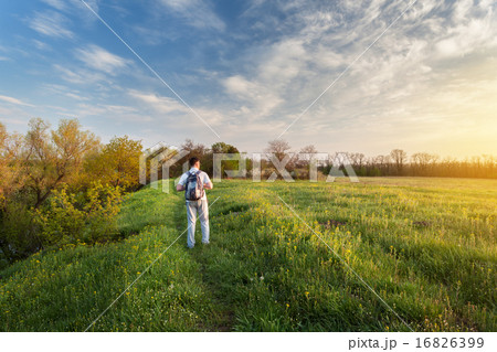 Beautiful sunset. Spring landscape with man の写真素材 [16826399] - PIXTA