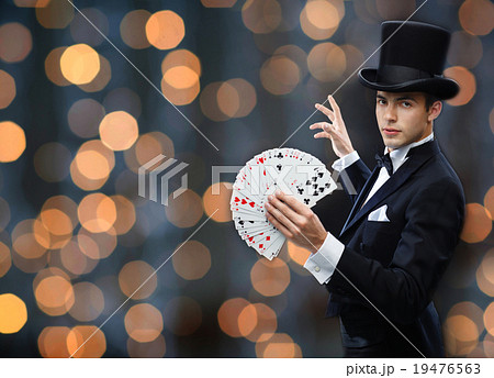 Magician Holding Cards