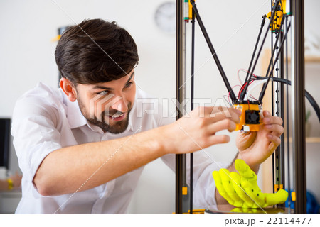 Cheerful man using 3d printer の写真素材 [22114477] - PIXTA