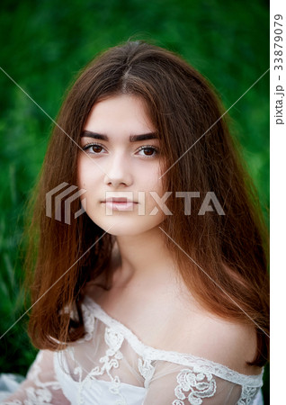 Beautiful bride in bright lace dress. In a fieldの写真素材 [33879079] - PIXTA