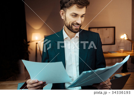 Handsome office worker doing his job with pleasureの写真素材 [34336193] - PIXTA