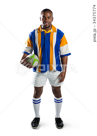 Portrait of happy rugby player holding ballの写真素材 [34375774] - PIXTA
