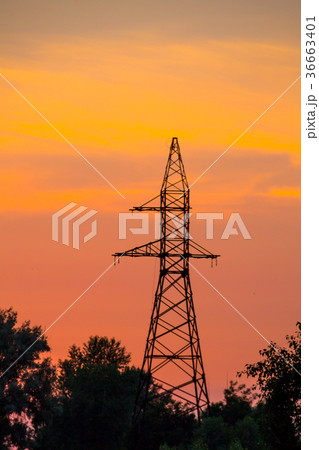 High voltage power tower at sunsetの写真素材 [36663401] - PIXTA