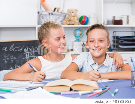 Portrait of boy with girl who are writing in...の写真素材 [40338952] - PIXTA