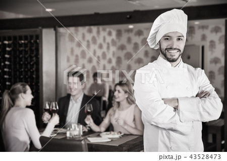 Confident smiling chef standing in restaurant hallの写真素材 [43528473] - PIXTA