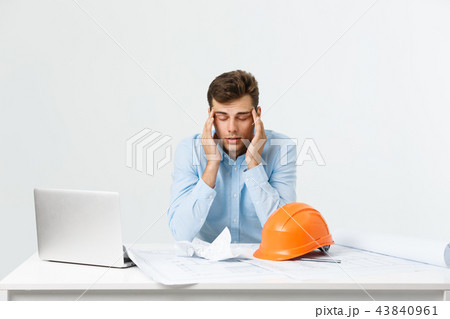 Portrait of engineer stress holding his head...の写真素材 [43840961] - PIXTA
