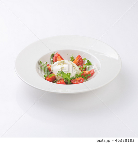 Salad with mozzarella on a white plate. Isolated.の写真素材 [46328183] - PIXTA