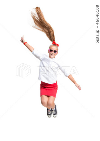 Cute little girl jump. Studio shot. White...の写真素材 [46646109] - PIXTA