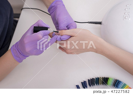 Nail coating colorless nail polish. Salon manicureの写真素材 [47227582] - PIXTA