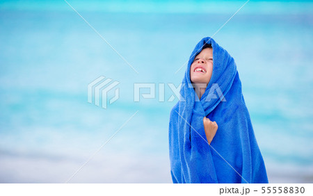 Adorable little girl wrapped in towel at...の写真素材 [55558830] - PIXTA