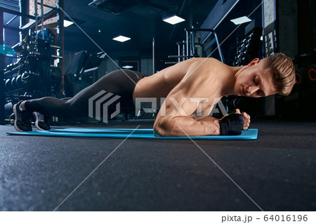 Muscular man doing doing plank exercise. | materials | digitalstage