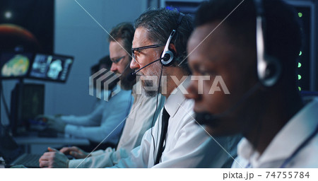Male operators working in control centerの写真素材 [74755784] - PIXTA