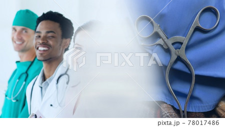 Composition of diverse group of doctors and surgical scissors with ...