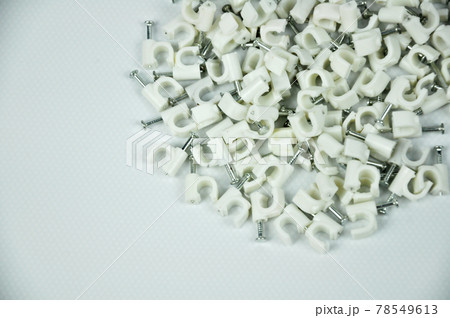 Plastic cable clips with concrete nails...の写真素材 [78549613] - PIXTA