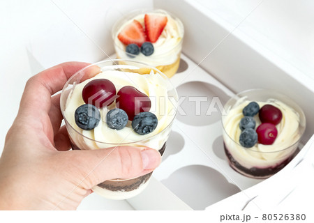 Human hand take a dessert with cream and...の写真素材 [80526380] - PIXTA