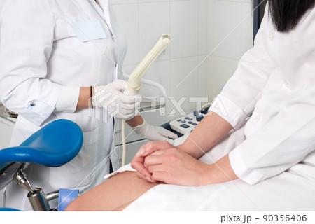 Gynecologist ready to do transvaginal ultrasound with wand and exam a ...