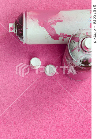 Some used pink aerosol spray cans and nozzles...の写真素材 [93052830] - PIXTA