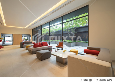 Inside of modern hotel lobby, entrance and reception, waiting area with ...