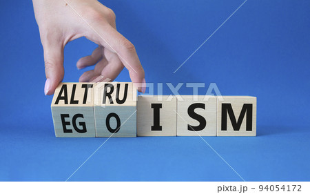Altruism and Egoism symbol. Hand turns a cube...の写真素材 [94054172] - PIXTA