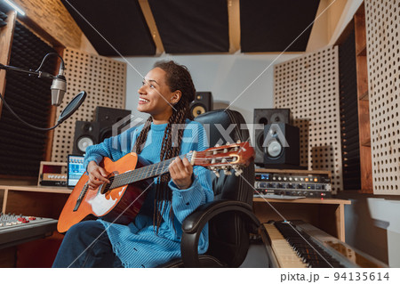 Stylish ethnic woman musician songwriter singer...の写真素材 [94135614] - PIXTA