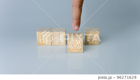 Hand pointing at one wood cube block with...の写真素材 [96271629] - PIXTA