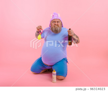 Fat angry man acts like a angry baby but drinks...の写真素材 [96314023] - PIXTA