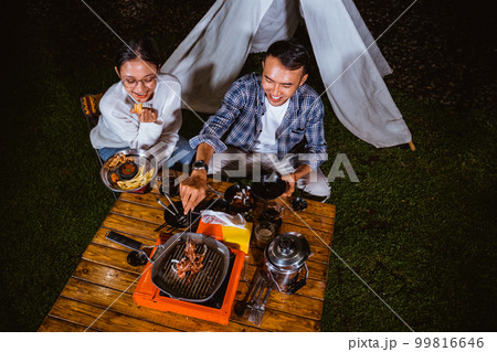 two mature eating together with the grilled beefの写真素材 [99816646] - PIXTA