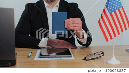 American consular officer showing passport...の写真素材 [100068827] - PIXTA