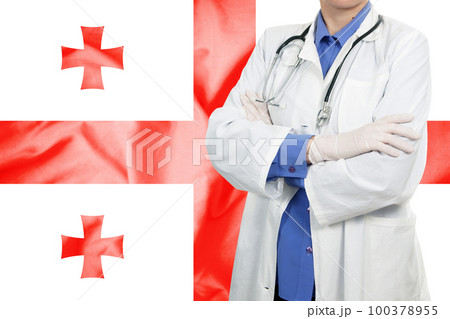 Doctor standing with the flagの写真素材 [100378955] - PIXTA