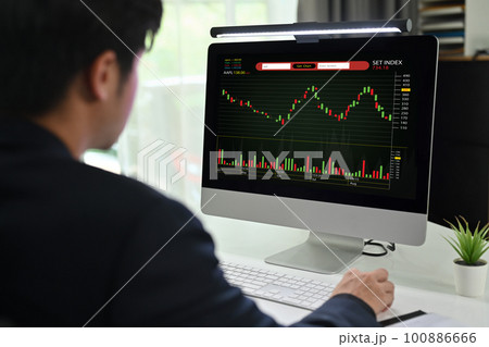 Back view of young trader in formal wear...の写真素材 [100886666] - PIXTA