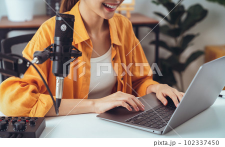 woman use microphones wear headphones with...の写真素材 [102337450] - PIXTA