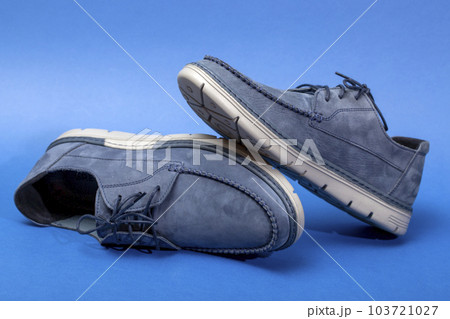 Blue leather men's shoes on a blue backgroundの写真素材 [103721027] - PIXTA
