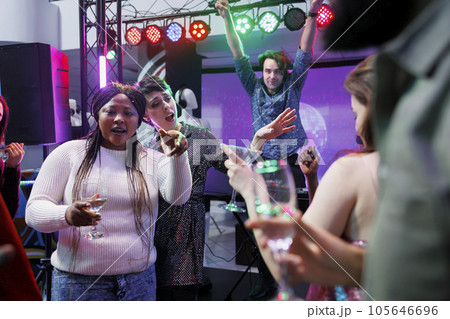 People drinking alcohol, dancing and singing at...の写真素材 [105646696] - PIXTA