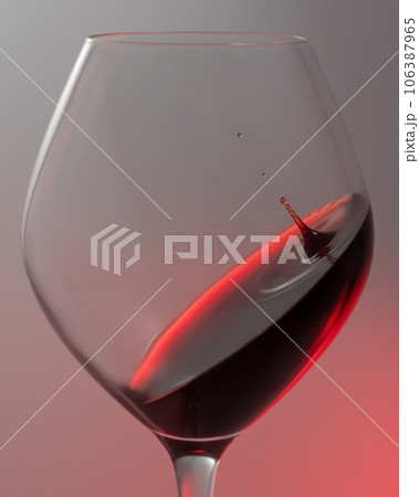 A falling drop of red wine in a glass, close-up.の写真素材 [106387965] - PIXTA