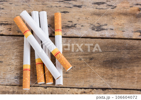 Cigarette roll on old wooden tableの写真素材 [106604072] - PIXTA