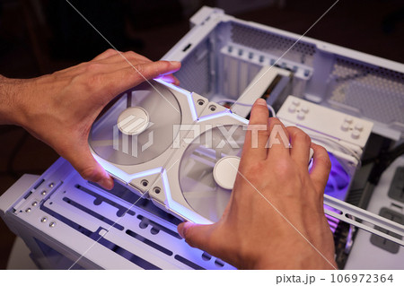 Computer technician installs cooling system of...の写真素材 [106972364] - PIXTA
