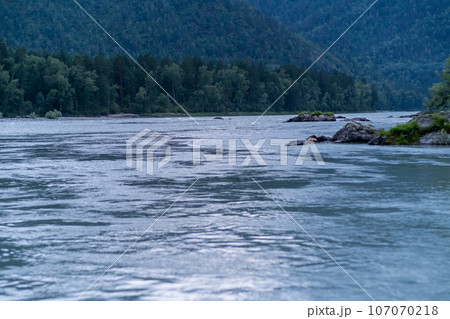 A wide, full-flowing mountain river with a fast...の写真素材 [107070218] - PIXTA