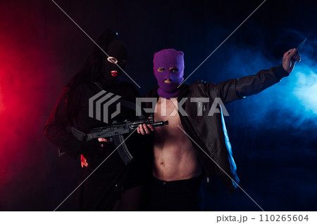 masked terrorists with weapons in the smokeの写真素材 [110265604] - PIXTA