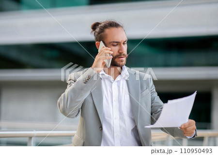 Business Call. Serious Young Businessman...の写真素材 [110950493] - PIXTA
