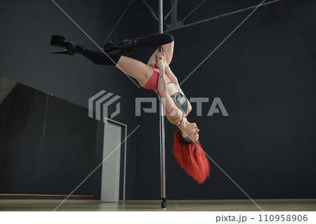 Full shot of strong Caucasian female pole...の写真素材 [110958906] - PIXTA
