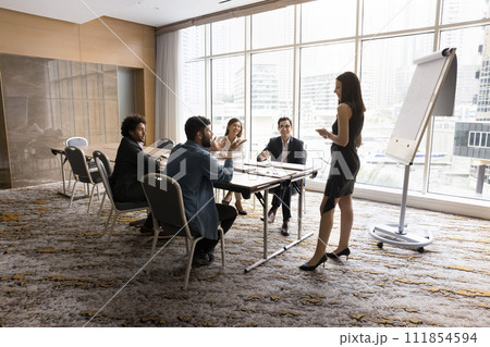 Beautiful young team manager woman speaking to...の写真素材 [111854594] - PIXTA