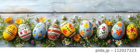 A row of Easter hand painted eggs on wooden...のイラスト素材 [112027223] - PIXTA
