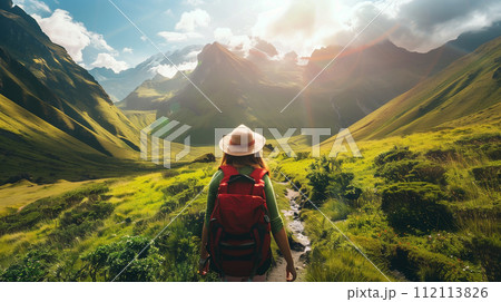 A lone hiker, back facing the camera, walks...のイラスト素材 [112113826] - PIXTA