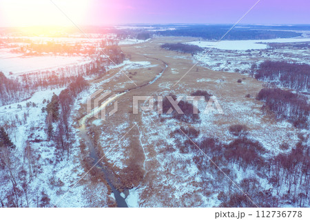 Aerial view of winding stream in the meadow at...の写真素材 [112736778] - PIXTA