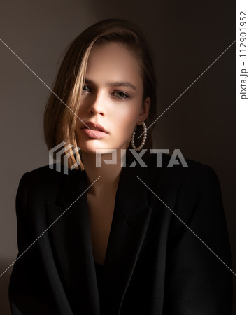 Fashionable girl model on dark grey background inの写真素材 [112901952] - PIXTA