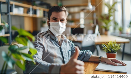 Professional man at work during pandemic gives...のイラスト素材 [114414409 ...