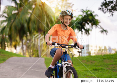 Boy riding bike in summer park. Bicycle ride.の写真素材 [115018349] - PIXTA